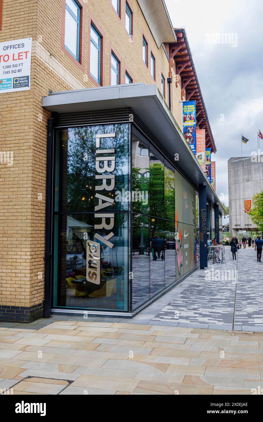 The modern glass-fronted public library in the town centre of Woking, a ...