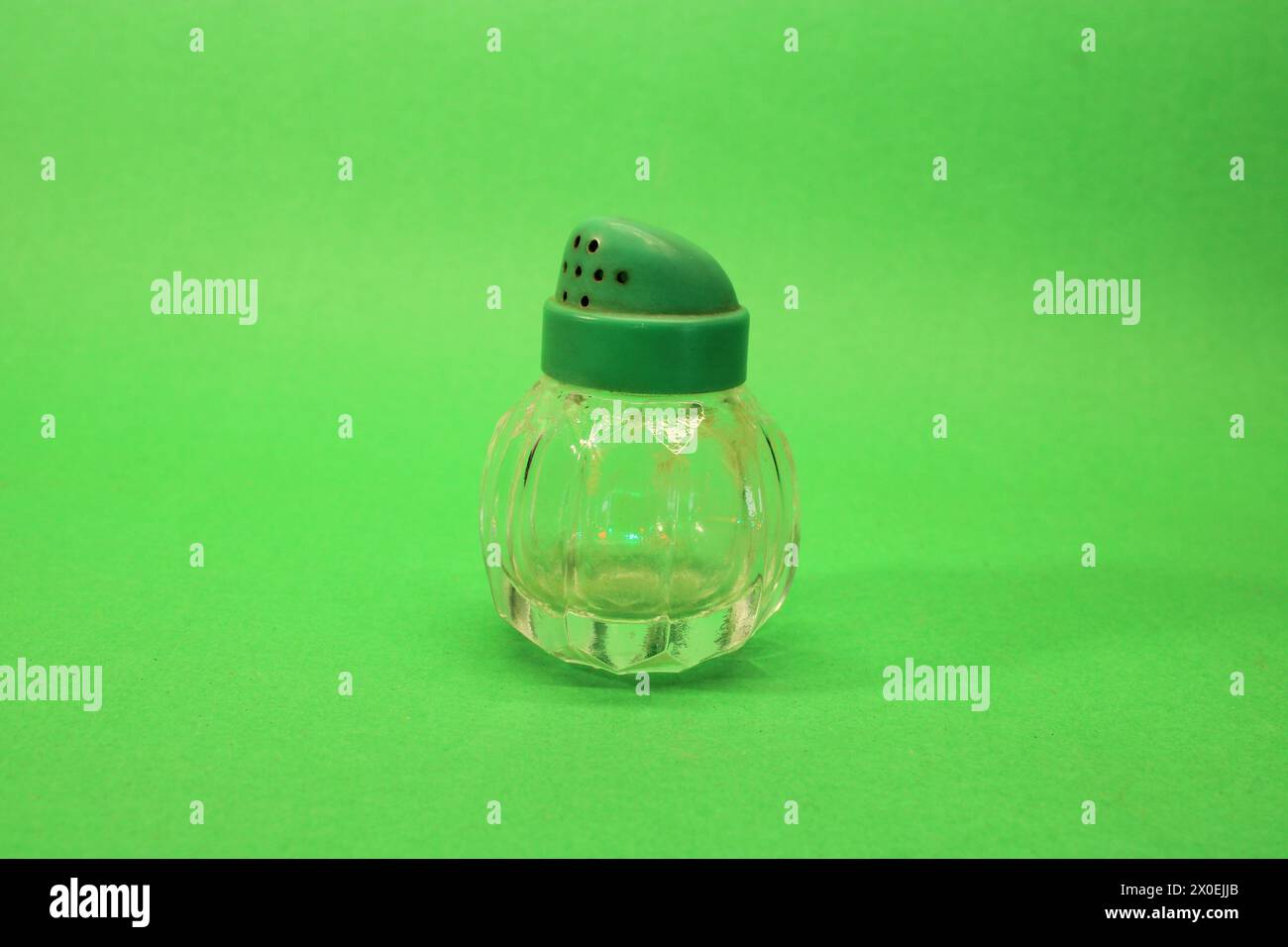 Antique glass and plastic salt shaker Stock Photo - Alamy