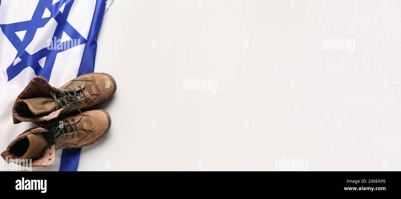 Flag of Israel with military boots on white background with space for ...