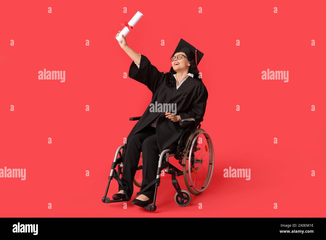 Beautiful female graduate student in wheelchair with graduation cap and ...