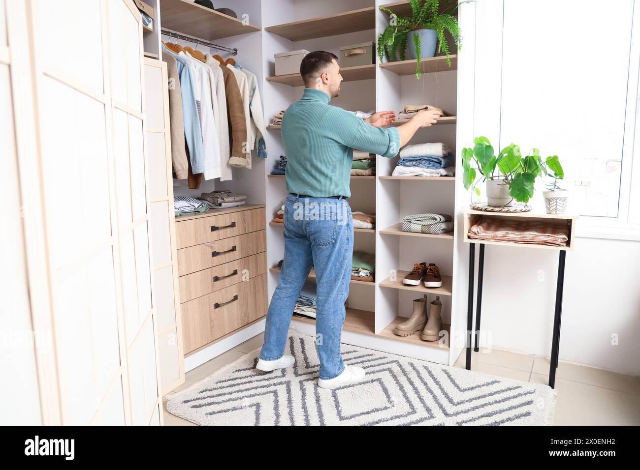 Taking clothes from closet hi-res stock photography and images - Alamy