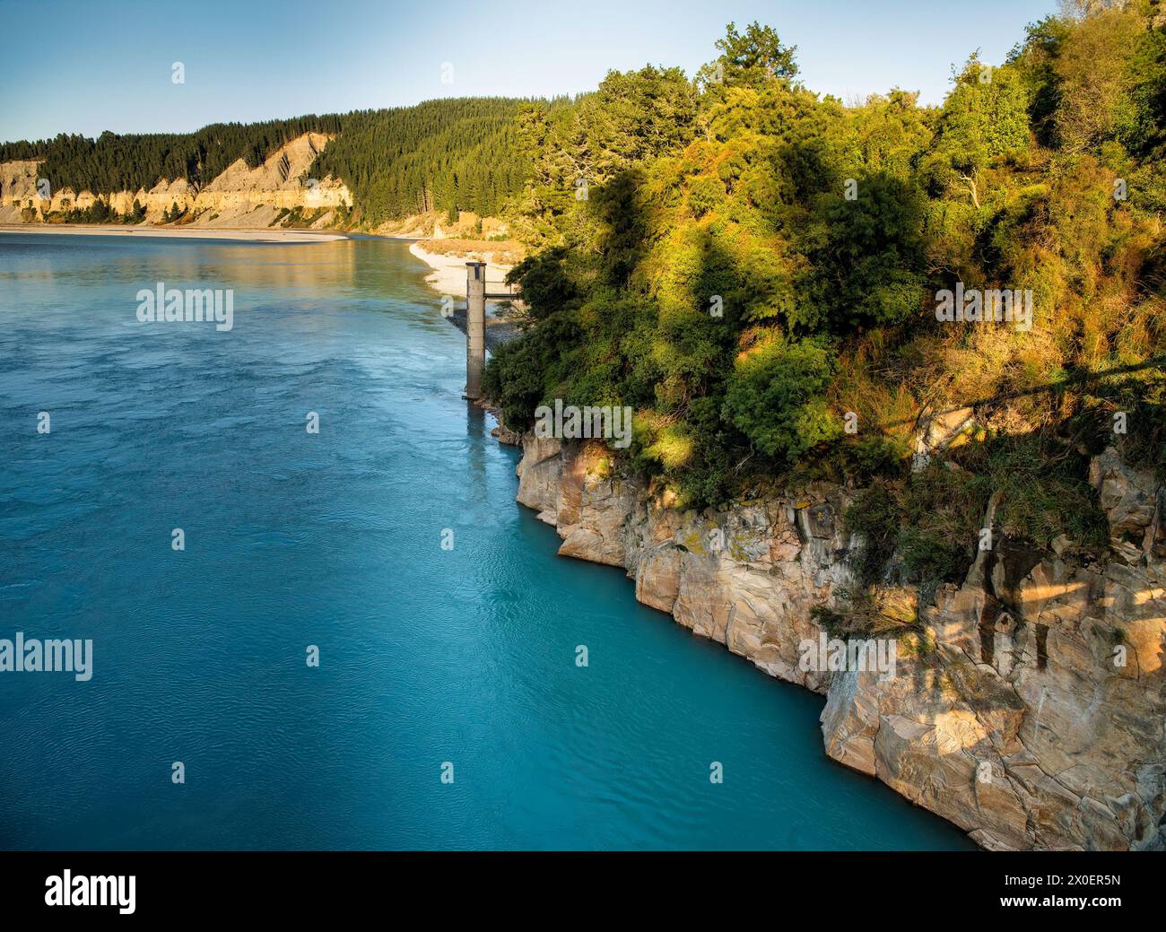The turquoise water of Rakaia river flowing through the gorge rock face ...