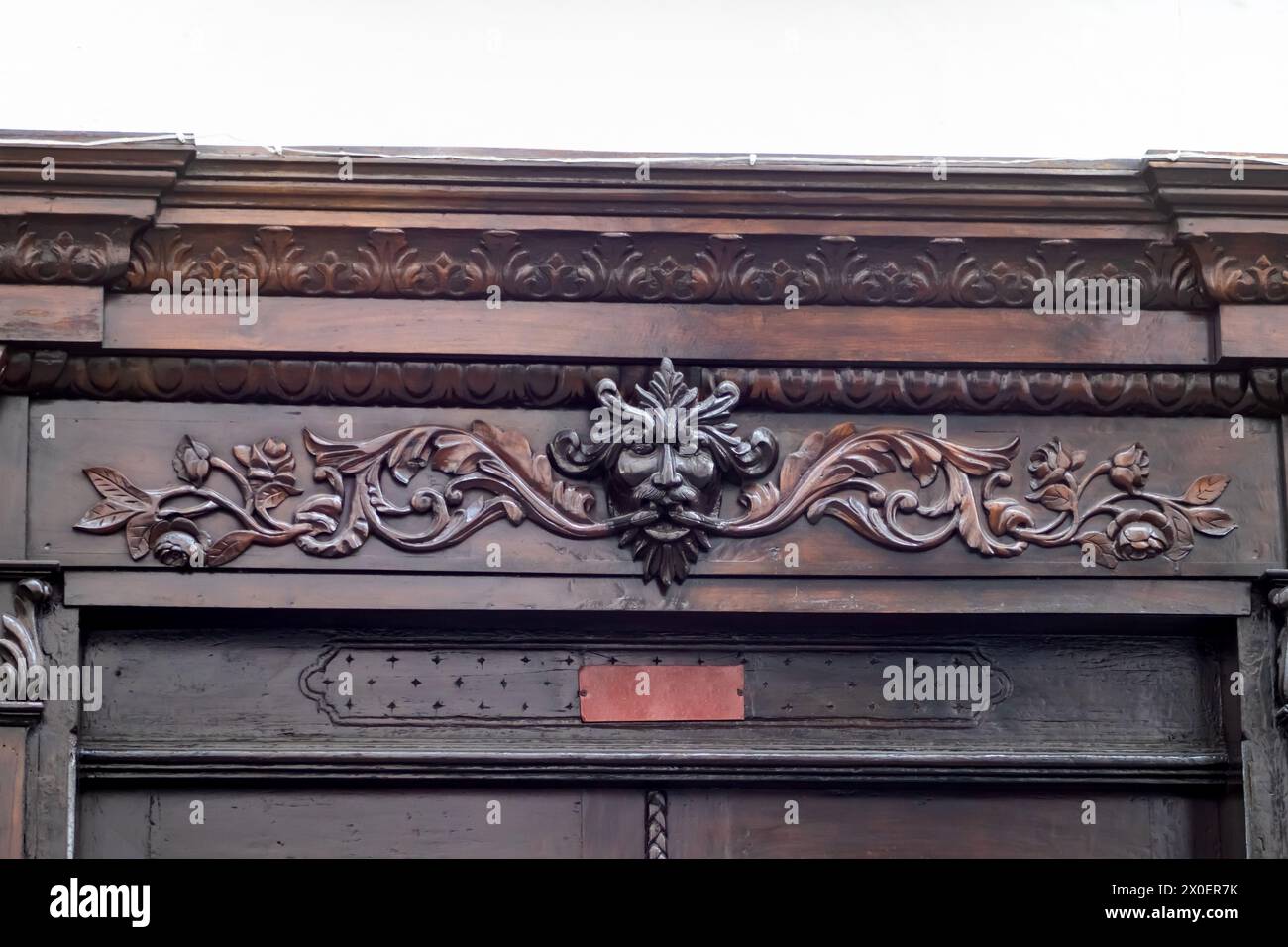 Image of the devil carved in wood on the top of an ancient door in the ...