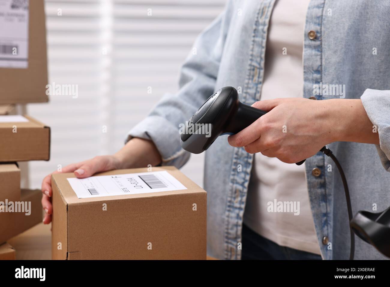Woman scanner reading parcel hi-res stock photography and images - Alamy