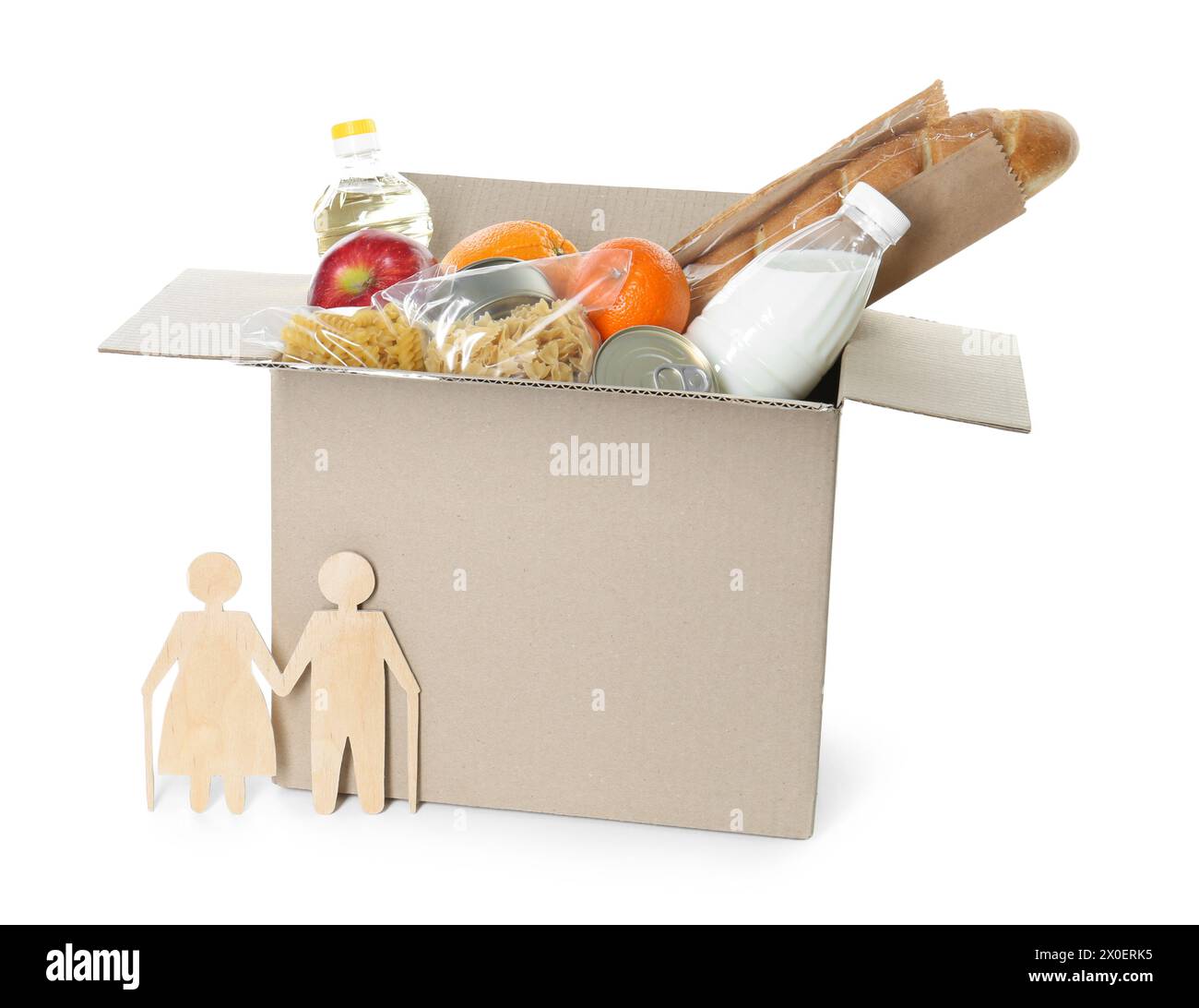 Humanitarian aid for elderly people. Cardboard box with donation food ...