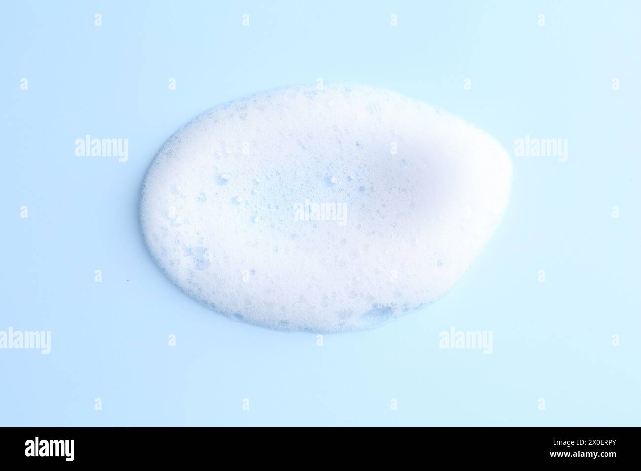 Sample of fluffy foam on light blue background, top view Stock Photo ...