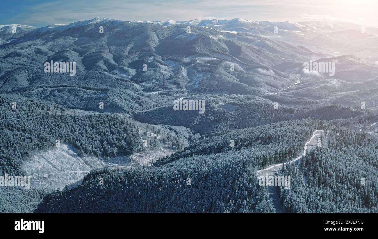 Aerial sunrise over snow mountain ranges. Winter nobody nature ...