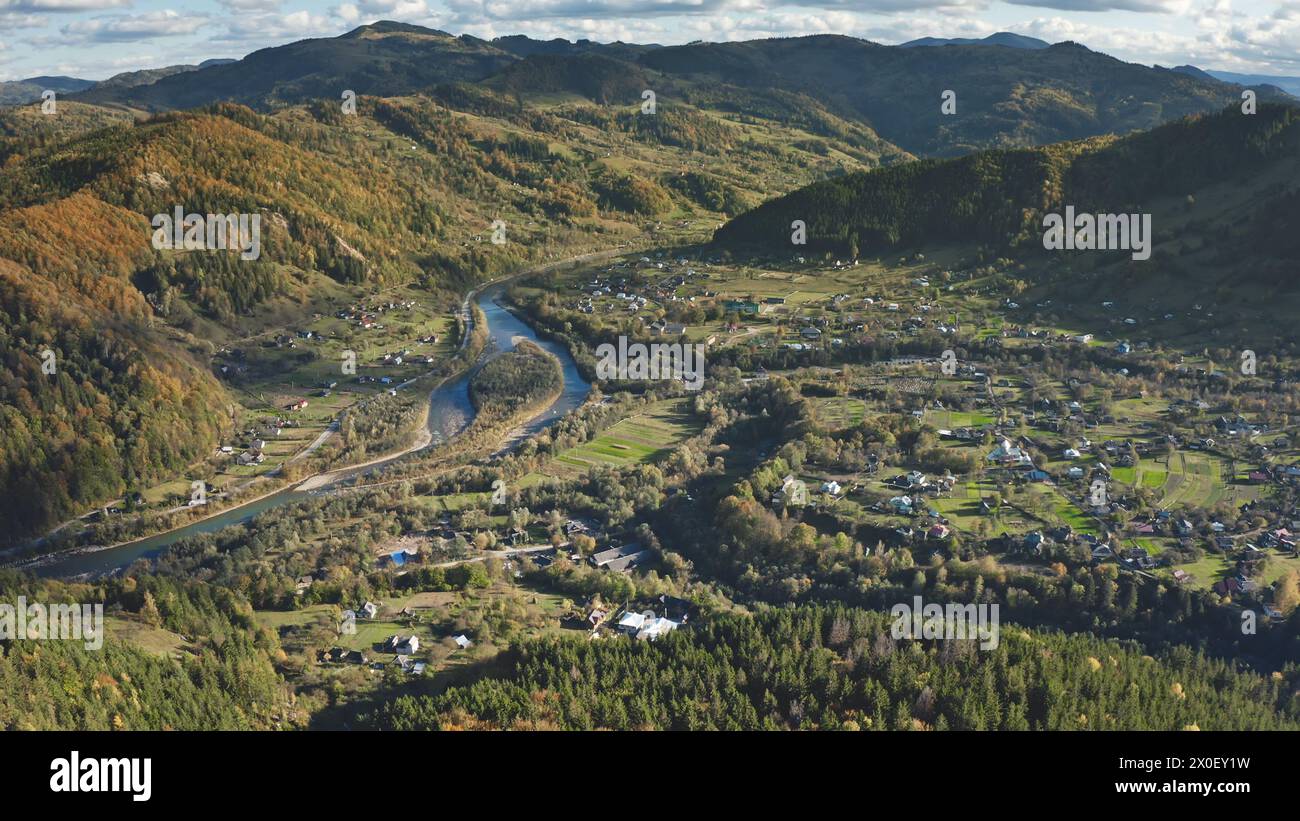 Mountain village at river aerial. Autumn nobody nature landscape ...
