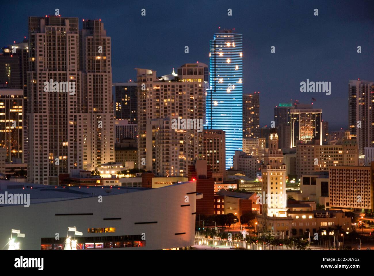 Bank of America Tower, a landmark high-rise building is lit blue with ...