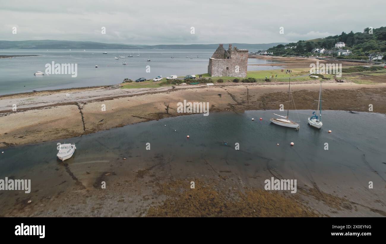 Sea gulls flying at brown sand beach on ocean shore aerial. Nature ...