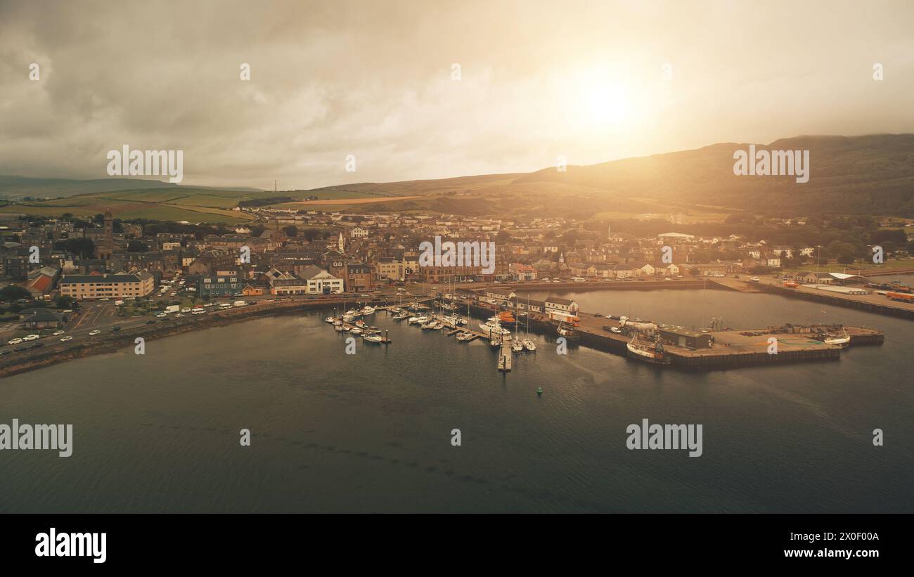 Pier town citycsape with historic buildings at ocean bay aerial. Sun ...