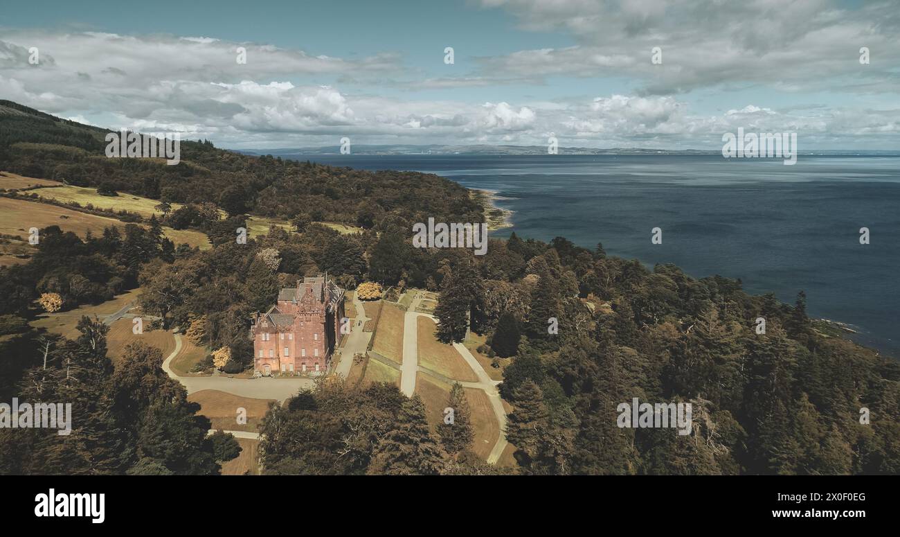 Scotland's landscape, medieval castle aerial view: trees and ocean ...