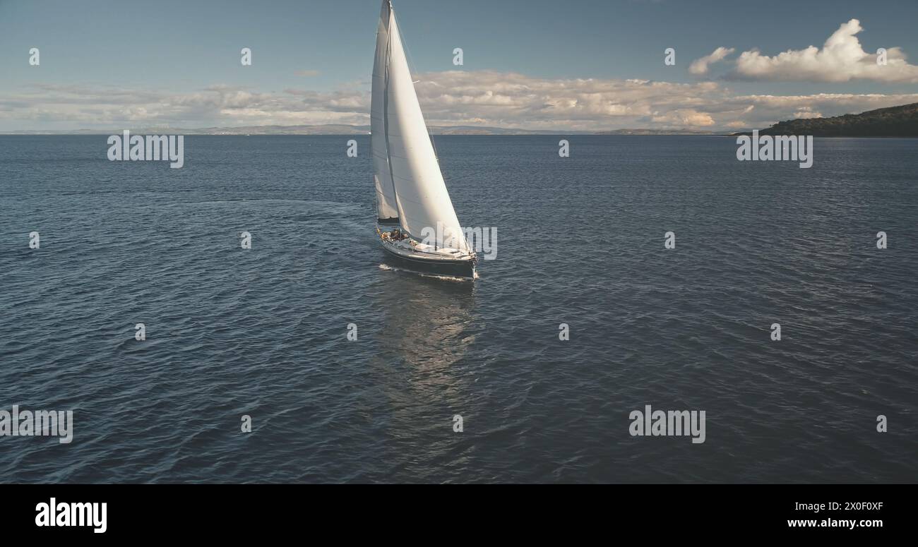 Aerial of yacht regatta under sails. Sailboat reflection at open sea ...