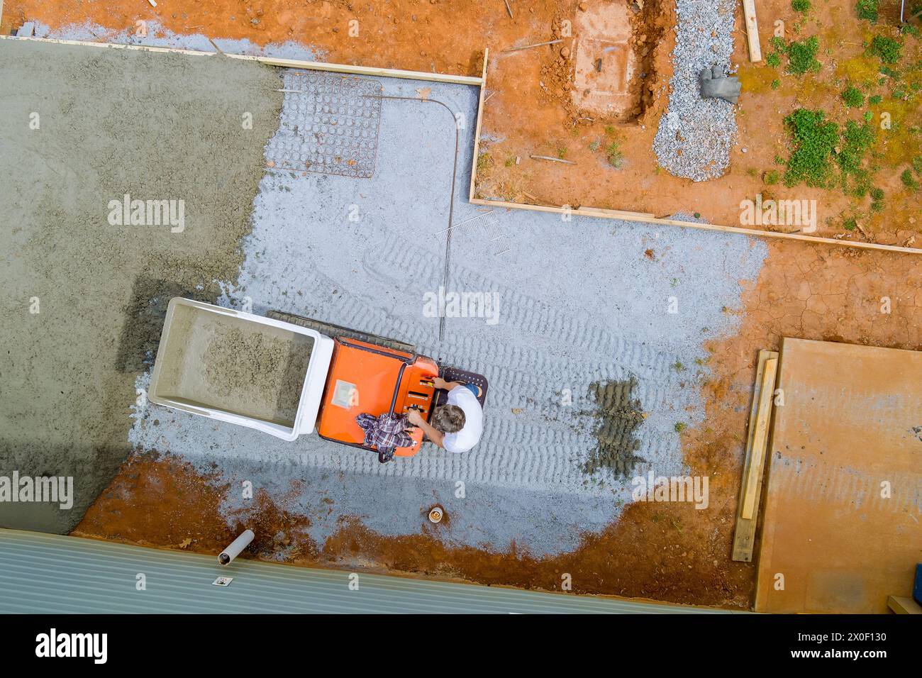 It is necessary to pour wet cement into framework from concrete buggy ...