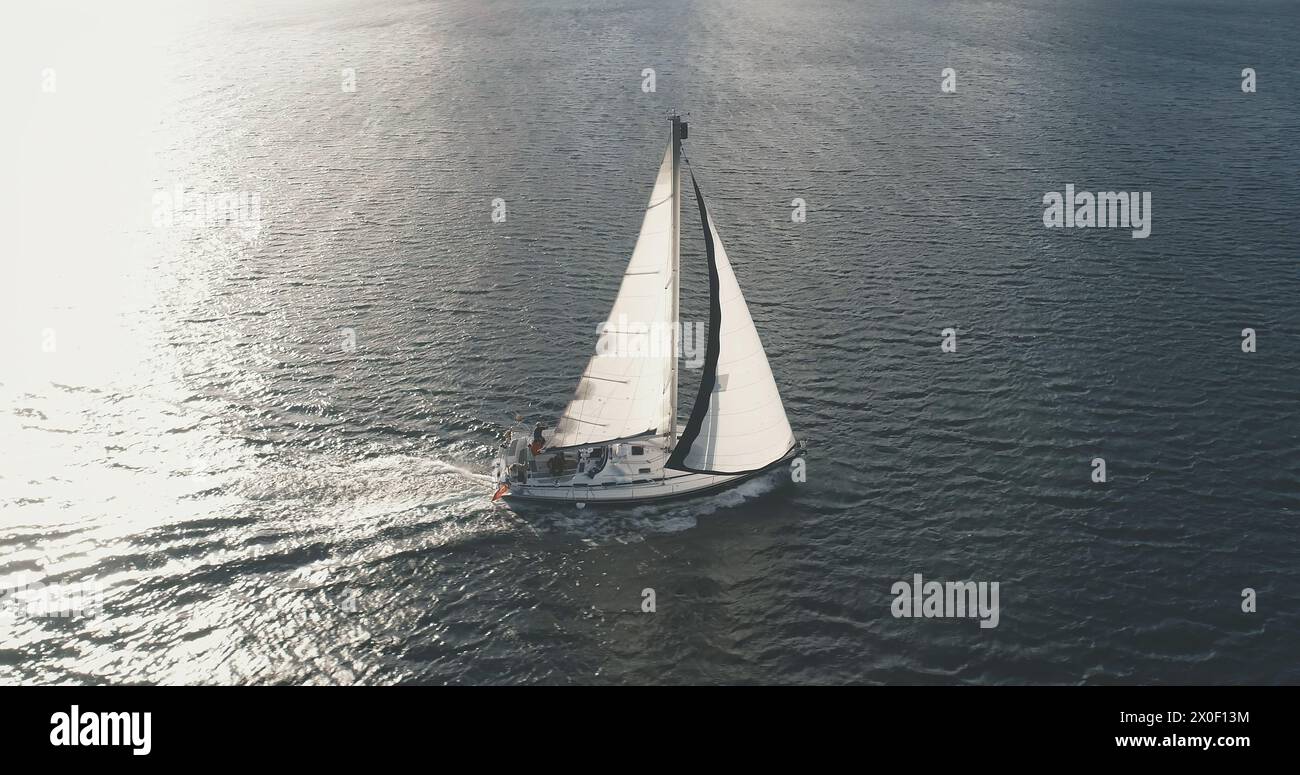 Luxury yacht at open sea racing under sails aerial. Amazing seascape of ...