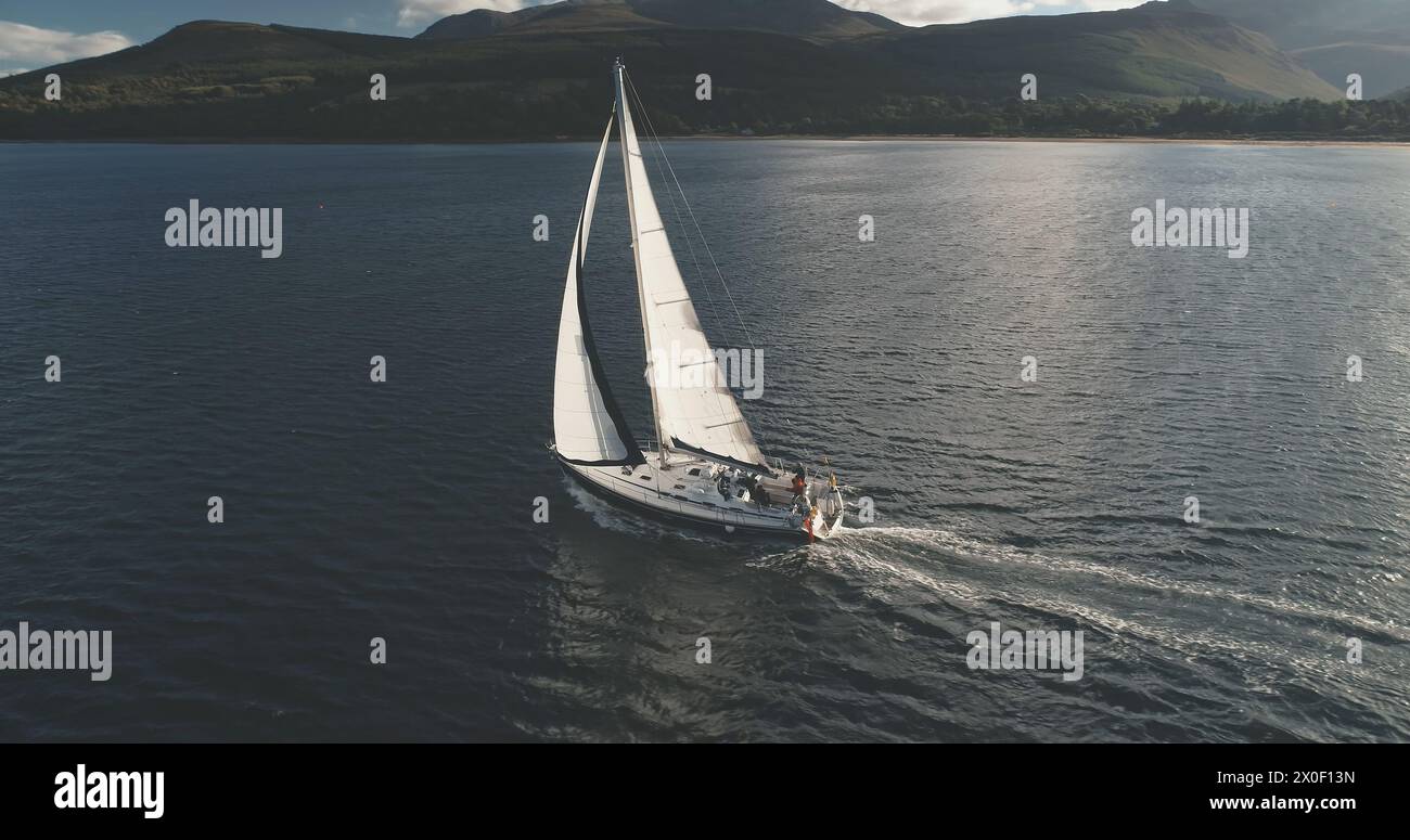 Luxury yacht at open sea racing under sails aerial. Amazing seascape of ...