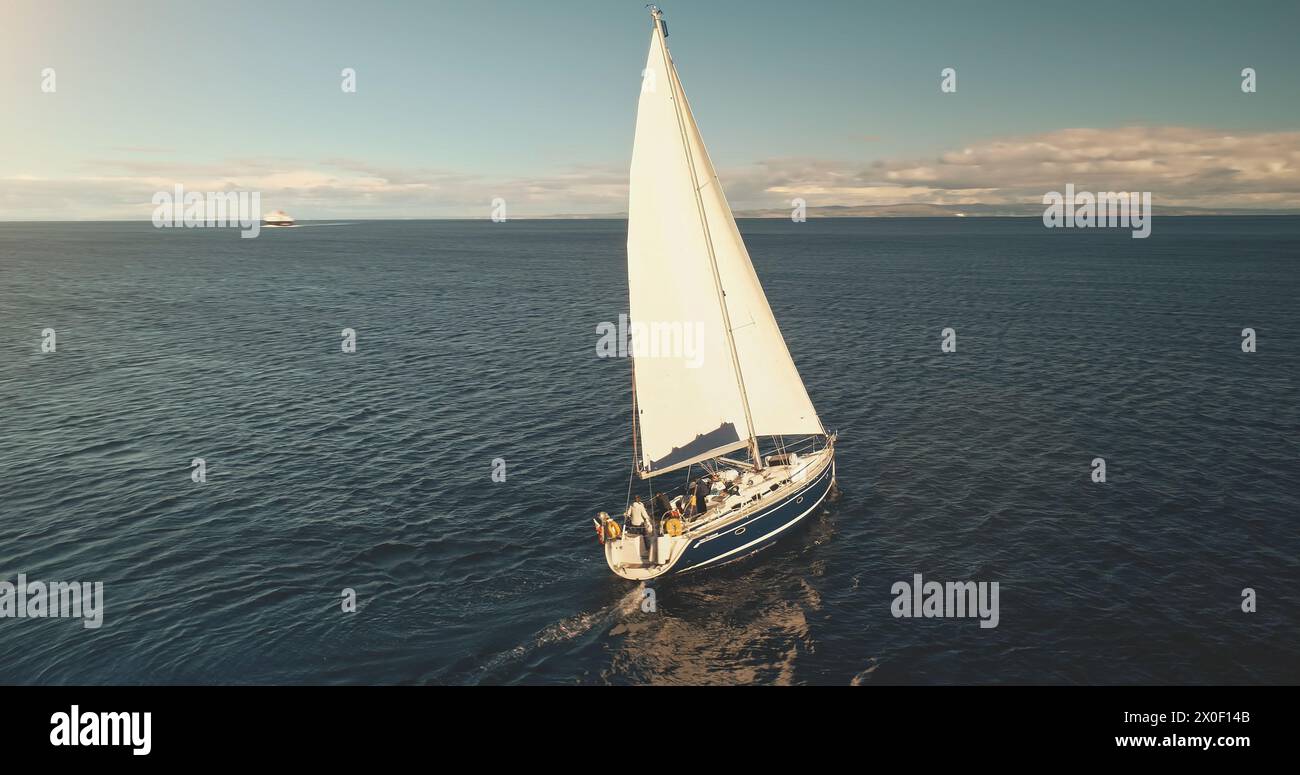 Yacht cruise in sunlight reflection at open sea bay aerial. Luxury ...