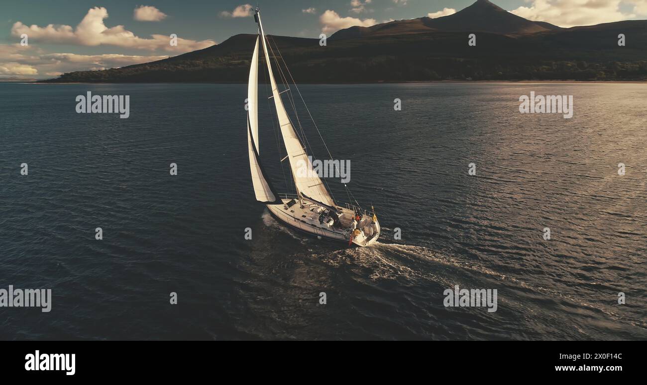 Yacht cruise in sunlight reflection at open sea bay aerial. Luxury ...