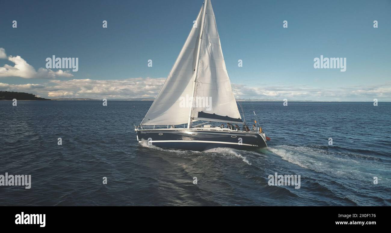 Slow motion closeup of sail luxury yacht at ocean bay aerial. Boat race ...