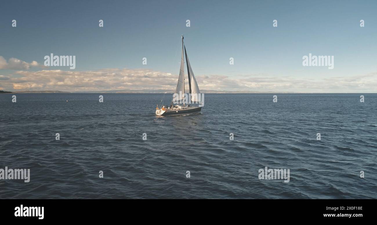 Slow motion of racing yacht at open sea aerial. Passengers on cruise ...