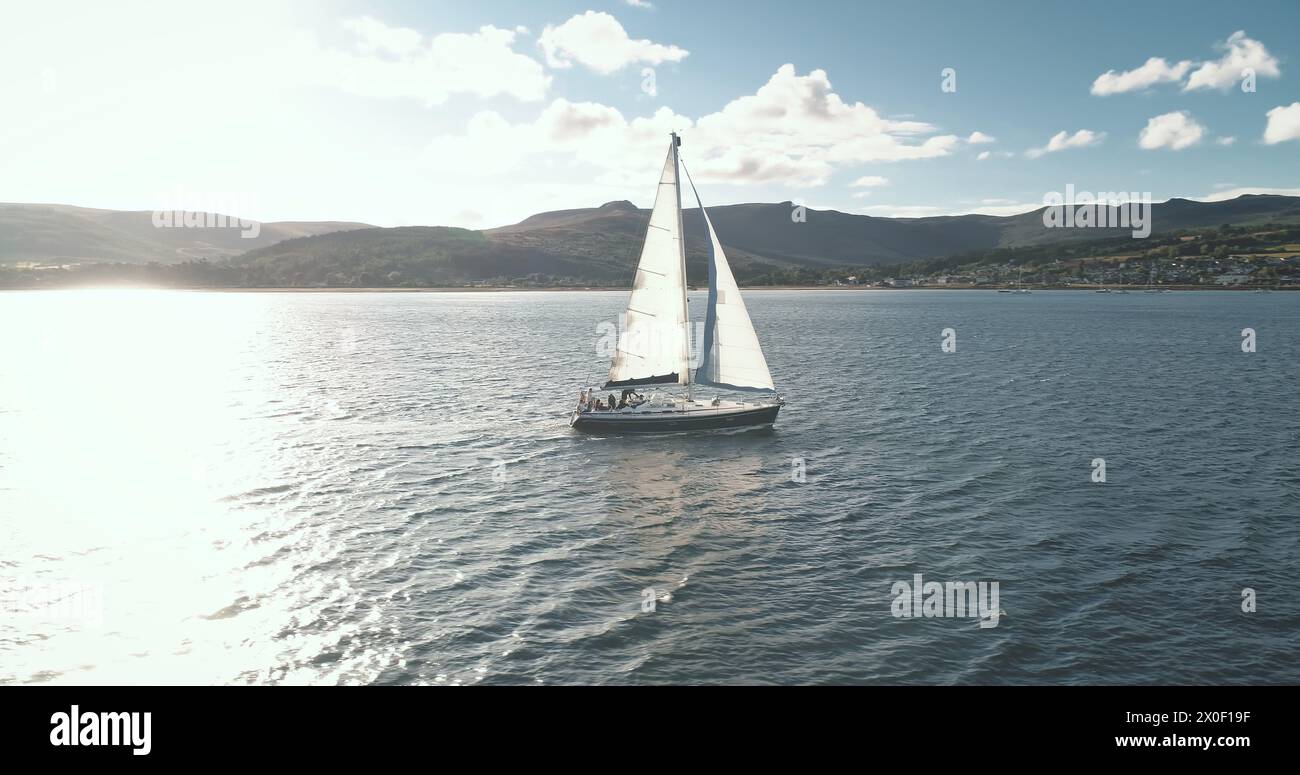 Slow motion of sun ocean gulf with yacht sailing aerial. Sunlight ...