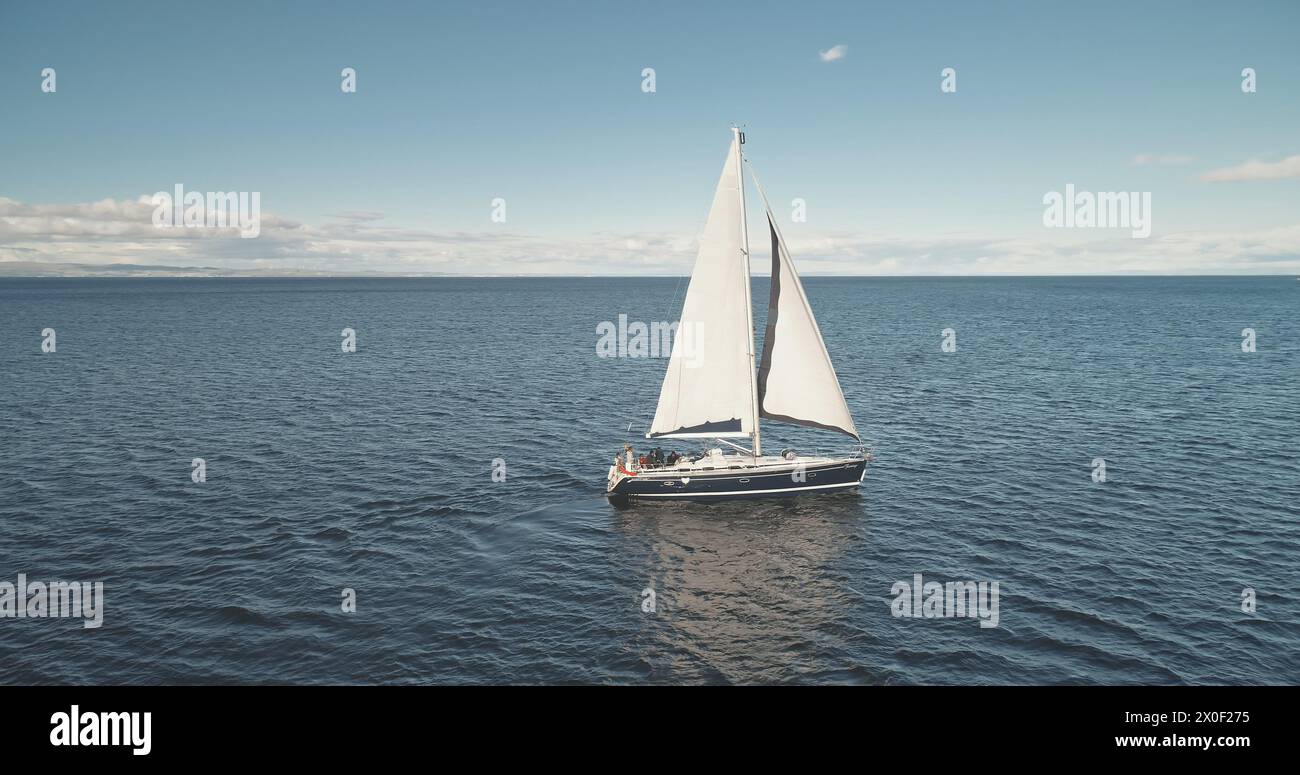 Slow motion sail boat reflection at sea bay aerial. Closeup sailboat at ...