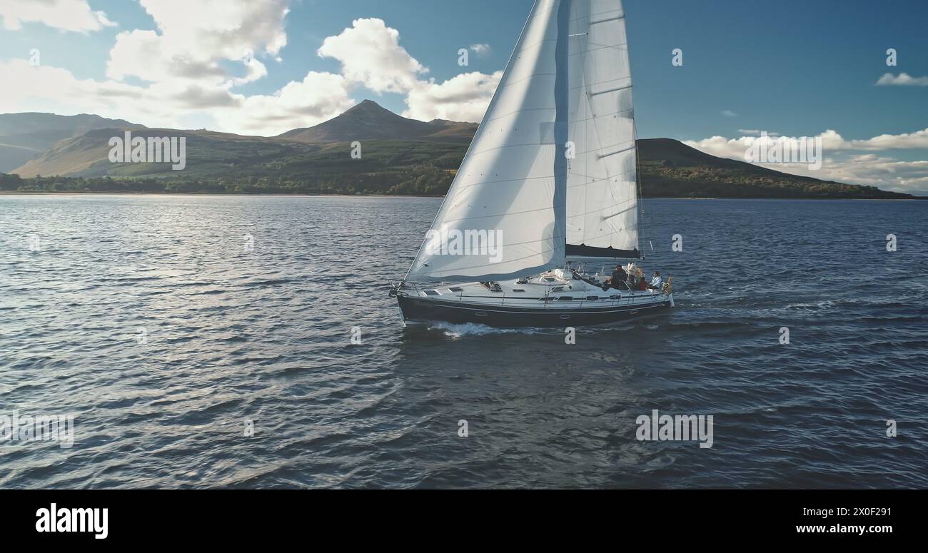 Closeup yacht race at ocean shore with green mountains. Seascape with ...
