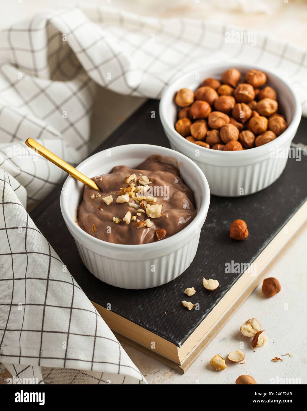 Indulgent chocolate-hazelnut mousse with crushed nuts, served in a ...