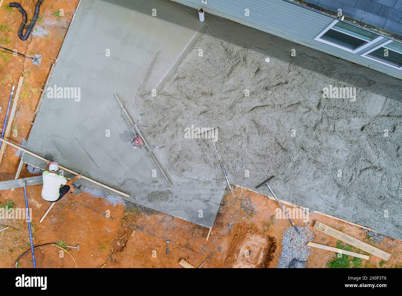 Construction worker leveling of concrete by using special tools Stock ...