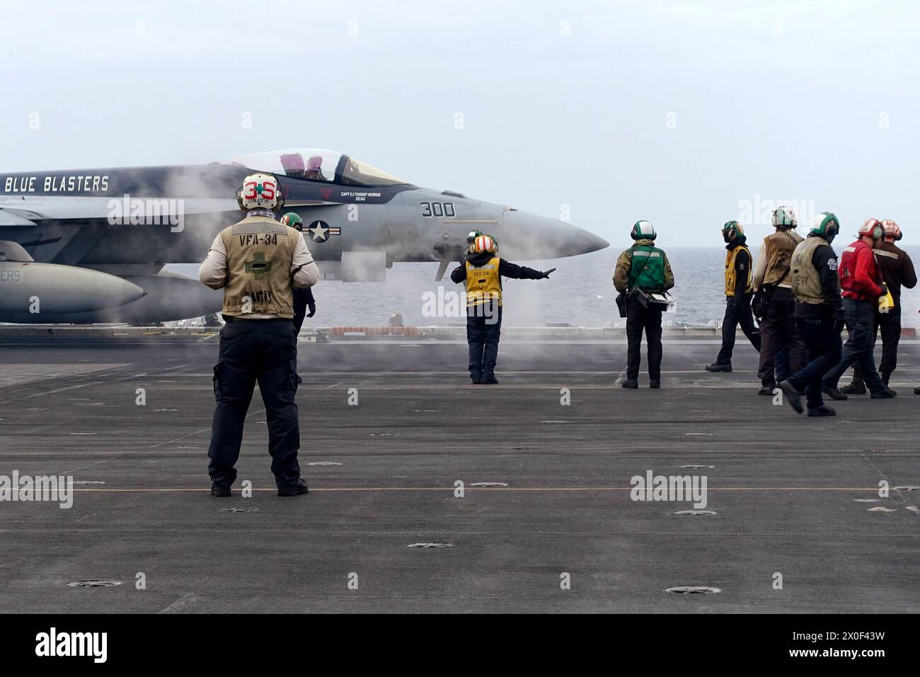 A F-18E fighter jet prepares to take off from USS Theodore Roosevelt ...