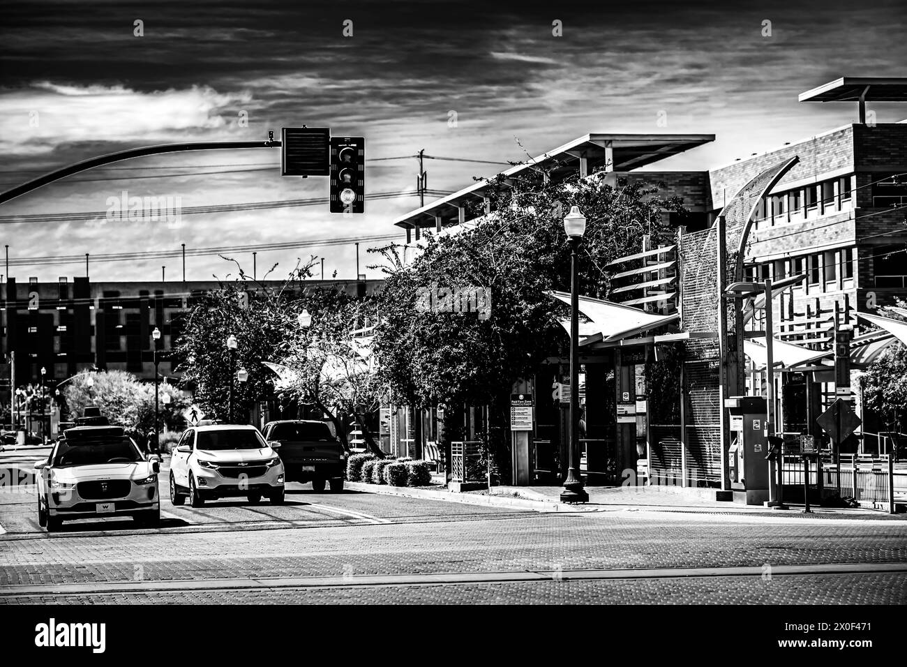 Phoenix, Arizona, USA - 3.23.2024: Behind a Waymo self-driving car ... Phoenix, Arizona, USA - 3.23.2024: Behind a Waymo self-driving car ...
