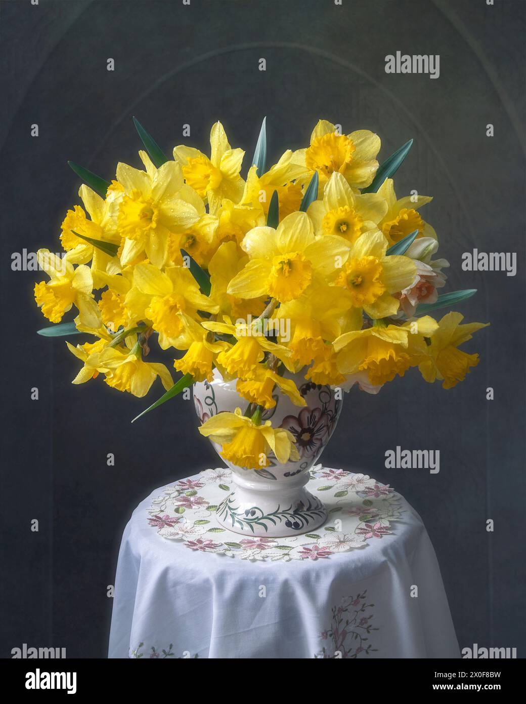 Still life with bouquet of yellow daffodils in vase Stock Photo - Alamy