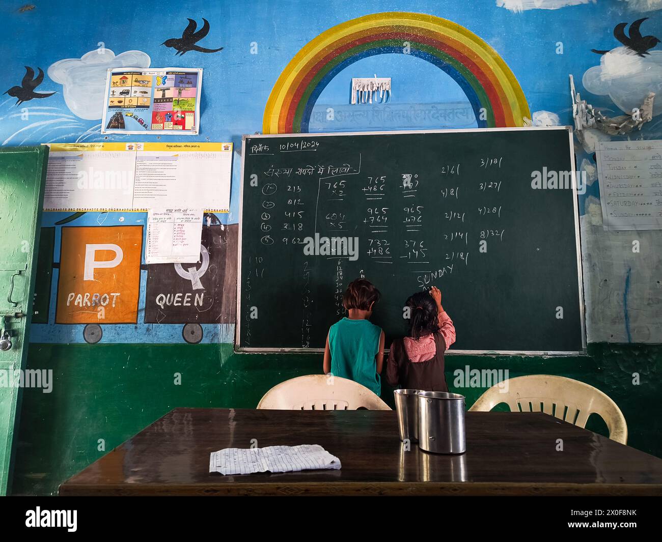 Two children writing on the board in rural Primary school of India ...
