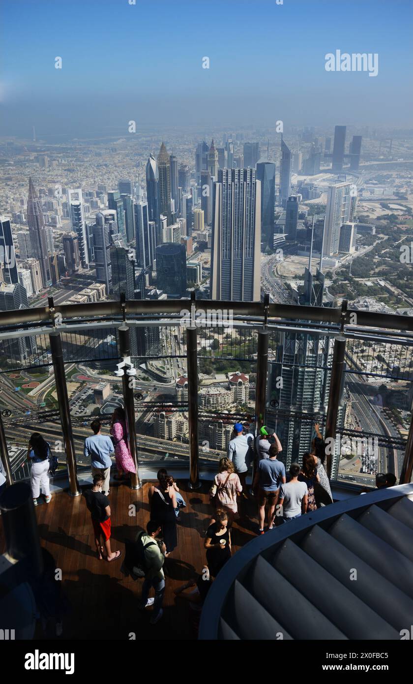 Tourist enjoying the city views from the outdoor terrace at the 124th ...