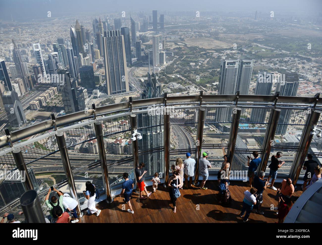 Tourist enjoying the city views from the outdoor terrace at the 124th ...
