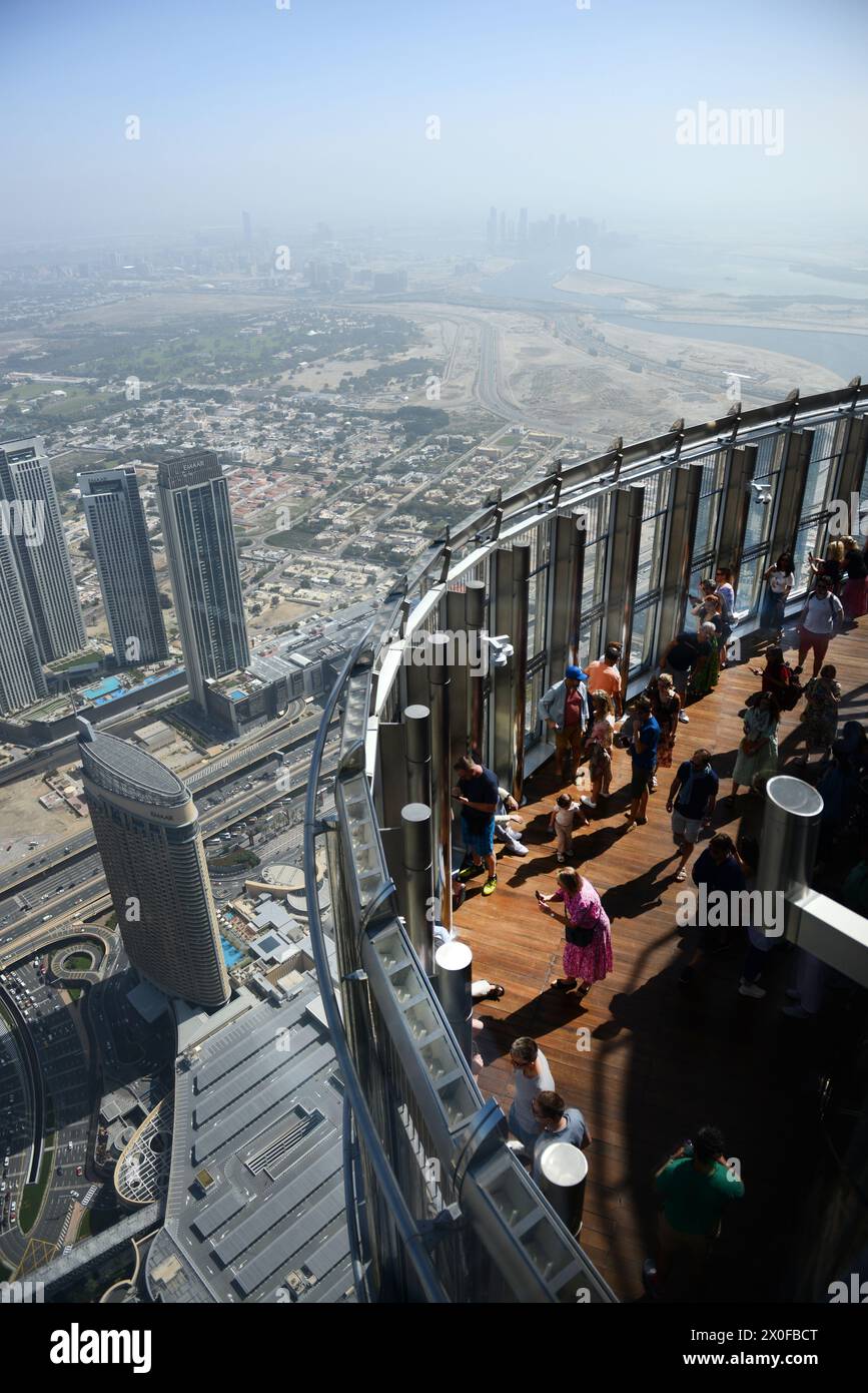 Tourist enjoying the city views from the outdoor terrace at the 124th ...