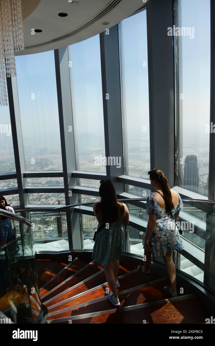Tourist enjoying the city views from the outdoor terrace at the 124th ...