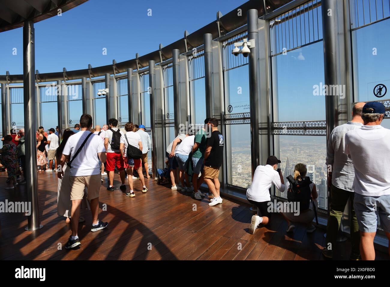 Tourist enjoying the city views from the outdoor terrace at the 124th ...