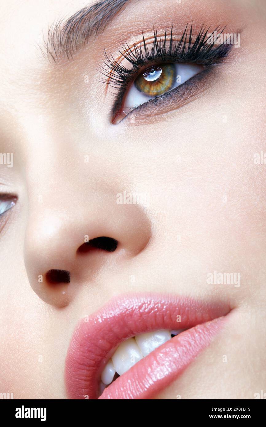 Closeup macro shot of human female face. Woman with eyes and lips ...