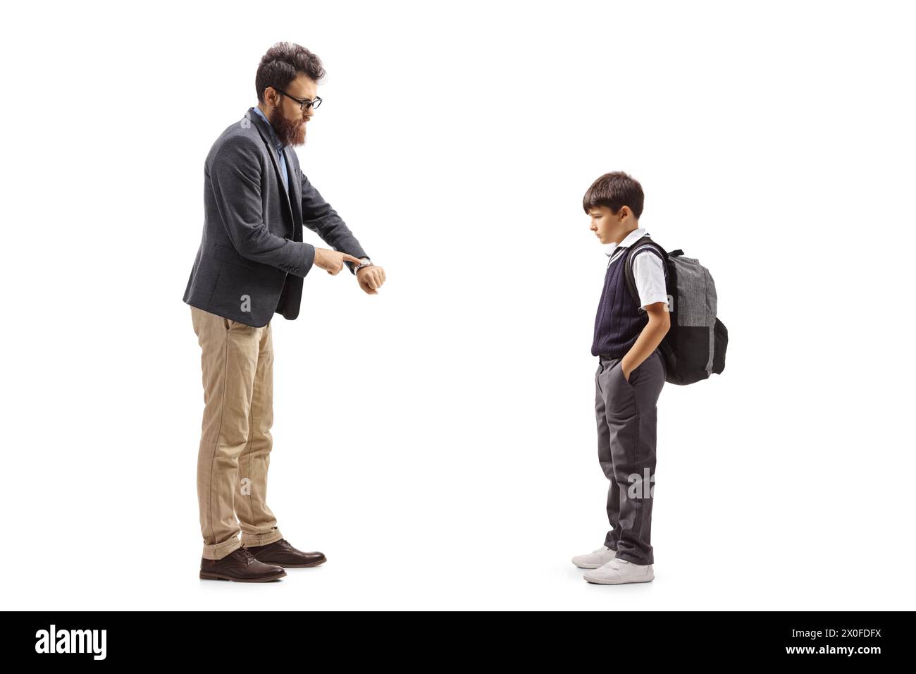 Full length profile shot of a man reprimanding a schoolboy and showing ...