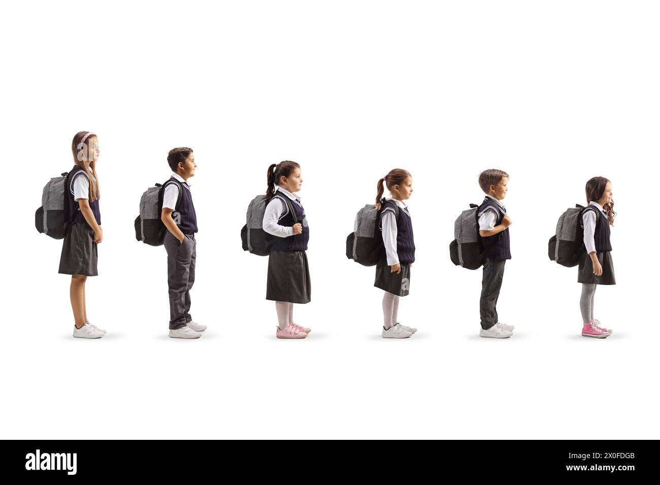 Full length profile shot of schoolchildren waiting in line isolated on ...