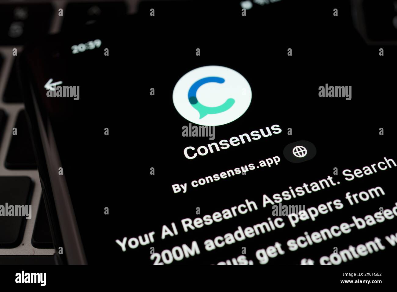 Consensus Custom Gpt Seen In Gpt Store On The Screen Of Smartphone Placed On Laptop Keyboad