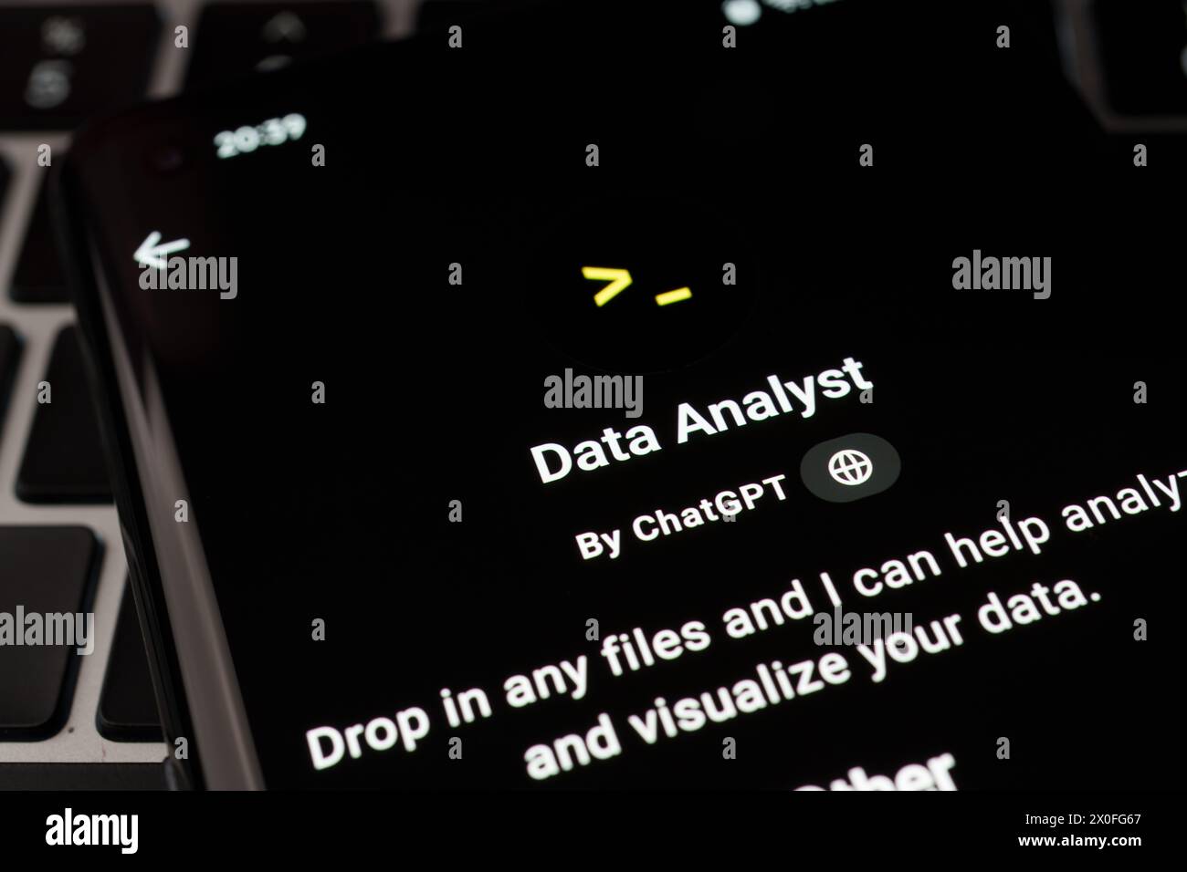 Data Analyst Custom Gpt Seen In Gpt Store On The Screen Of Smartphone Placed On Laptop Keyboad 0288