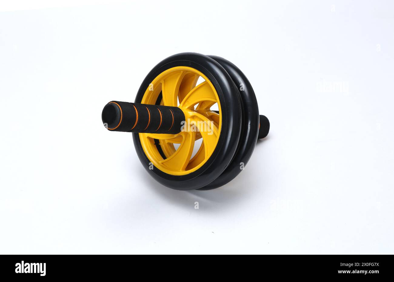 yellow black exercise wheel isolated on white background Stock Photo ...