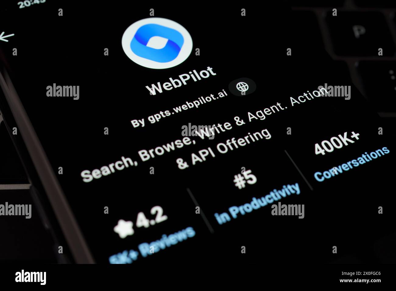 Webpilot Custom Gpt Seen In Gpt Store On The Screen Of Smartphone Placed On Laptop Keyboad