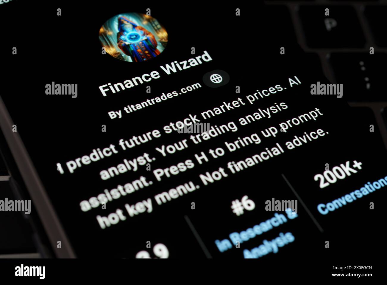 Finance Wizard Custom Gpt Seen In Gpt Store On The Screen Of Smartphone Placed On Laptop Keyboad