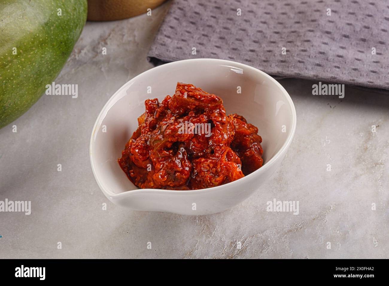 Indian cuisine Spicy pickled raw green mango Stock Photo - Alamy