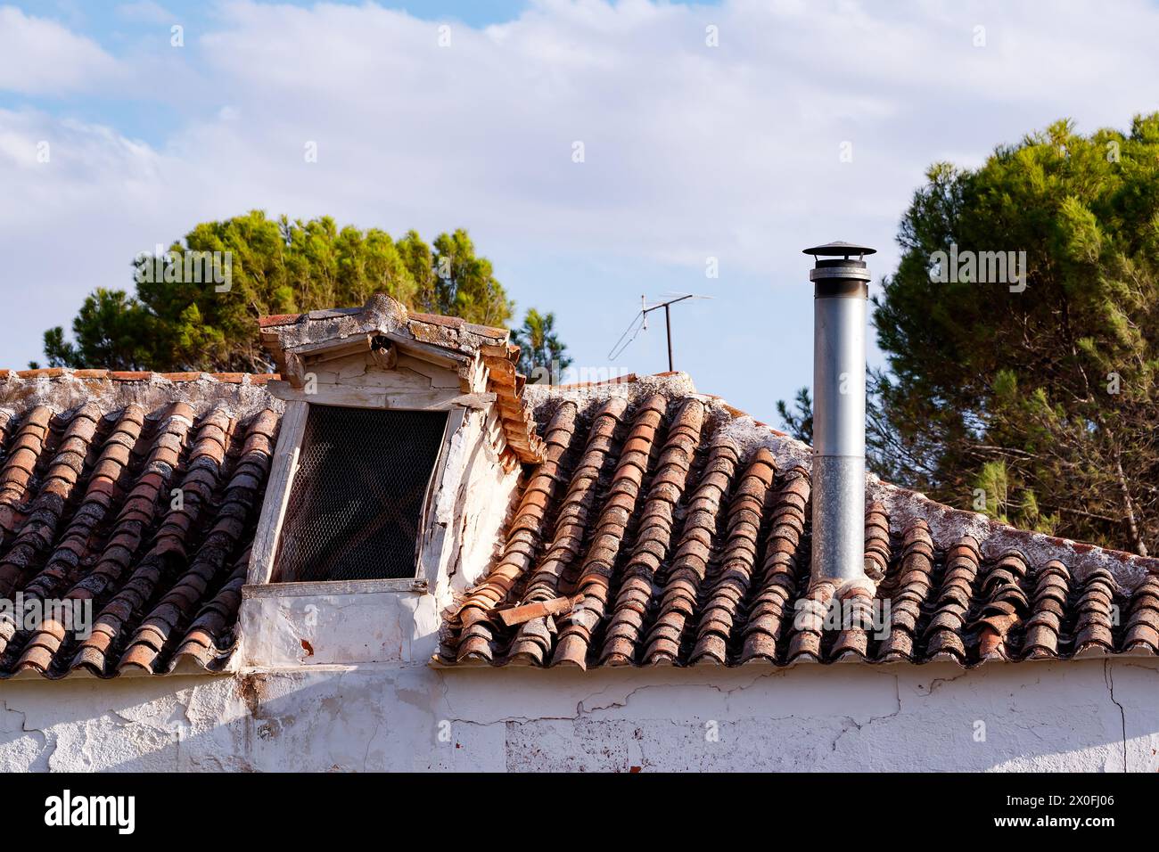 Window and chimney on a roof in Alhambra Stock Photo - Alamy