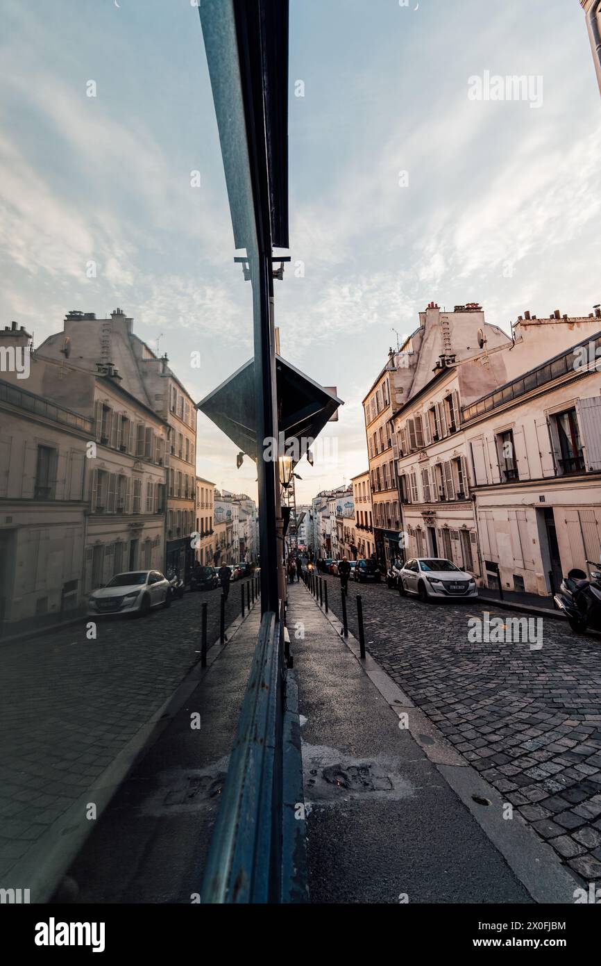 Monmartre street sunset reflecting in a window Stock Photo - Alamy