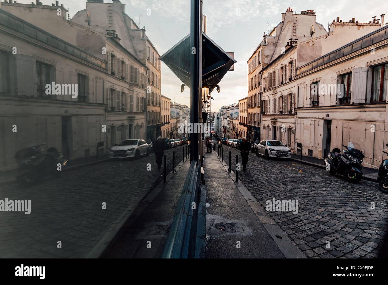 Monmartre street sunset reflecting in a window Stock Photo - Alamy